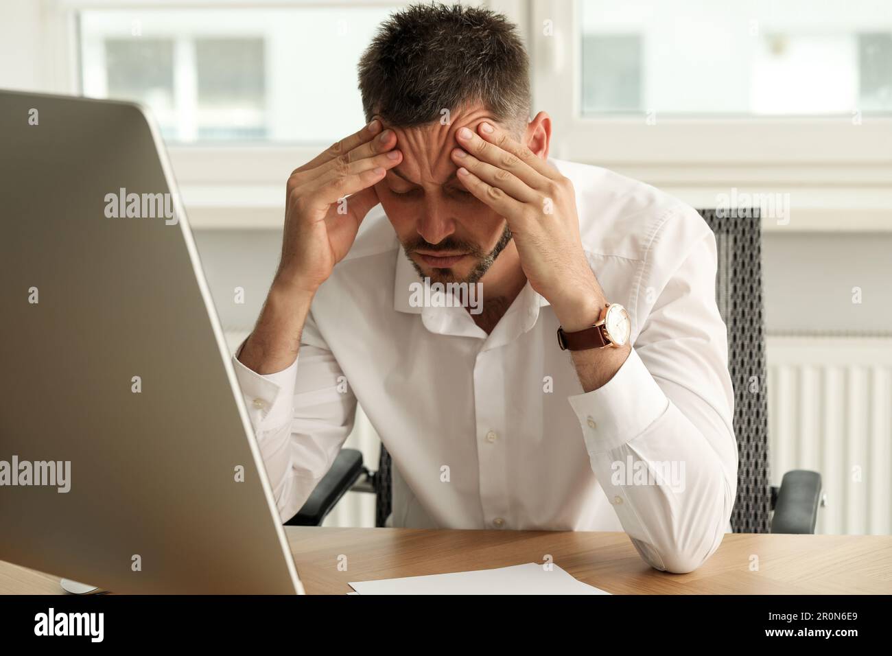 Sleep deprived man at workplace in office Stock Photo - Alamy