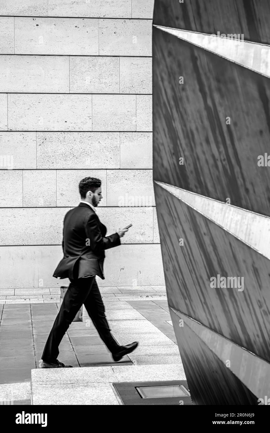 Man walking past interesting sculpture in city of london Stock Photo ...