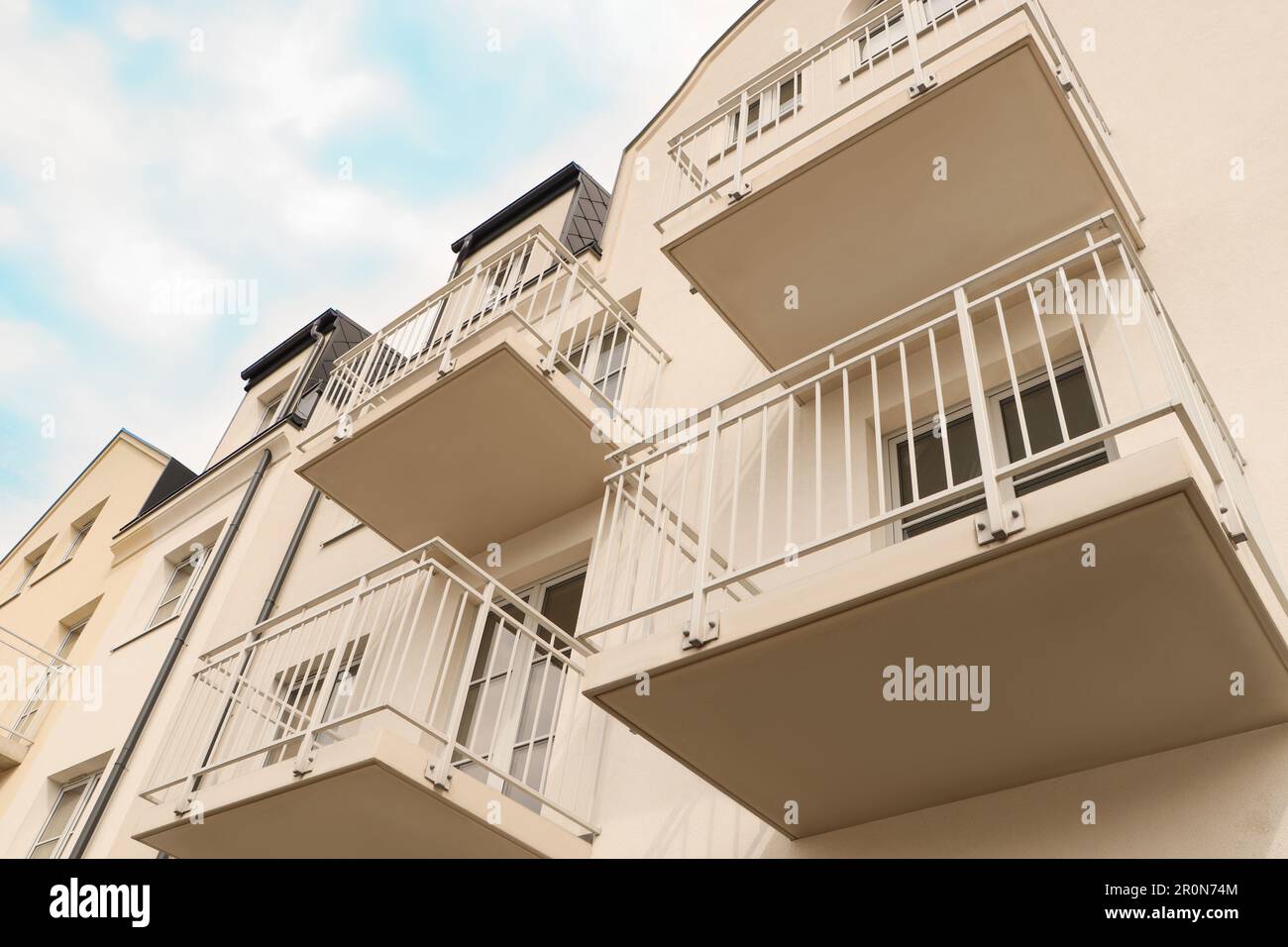 Exterior of beautiful building with empty balconies, low angle view ...