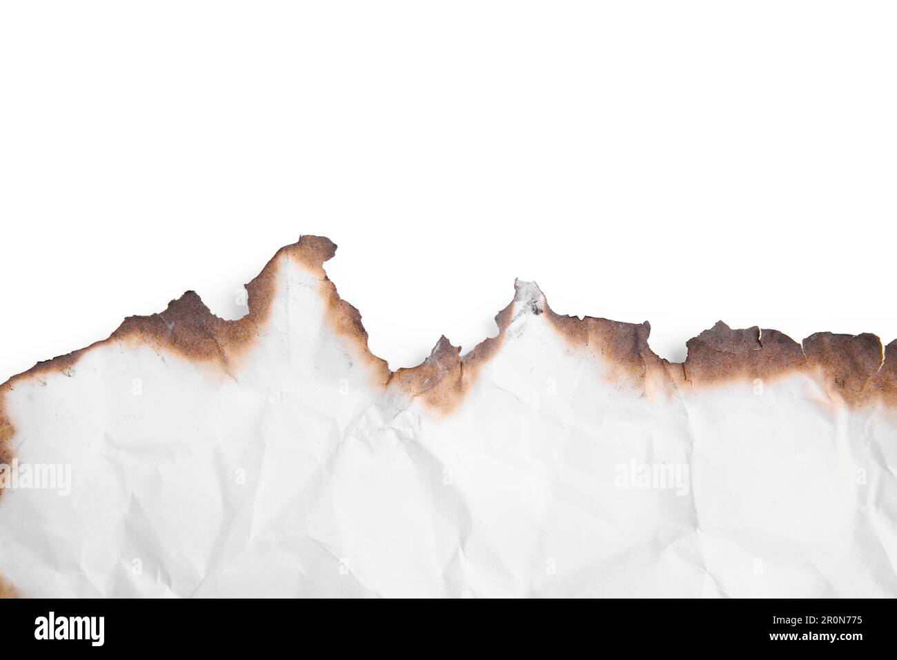 Piece of crumpled paper with dark burnt borders on white background ...
