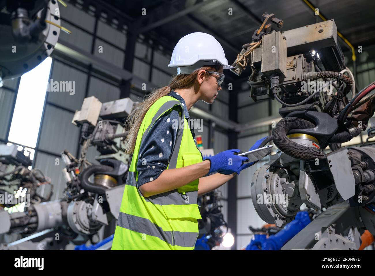Factory worker managing industrial machine hi-res stock photography and ...
