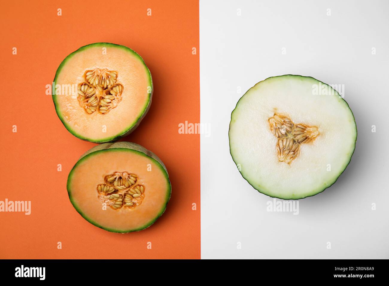 Cut different types of melons on color background, flat lay Stock Photo ...