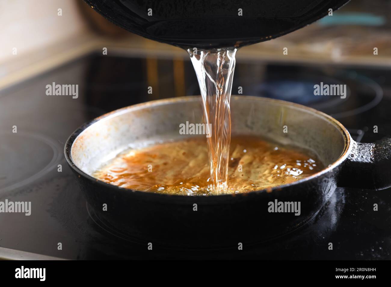 Pouring used cooking oil hi-res stock photography and images - Alamy