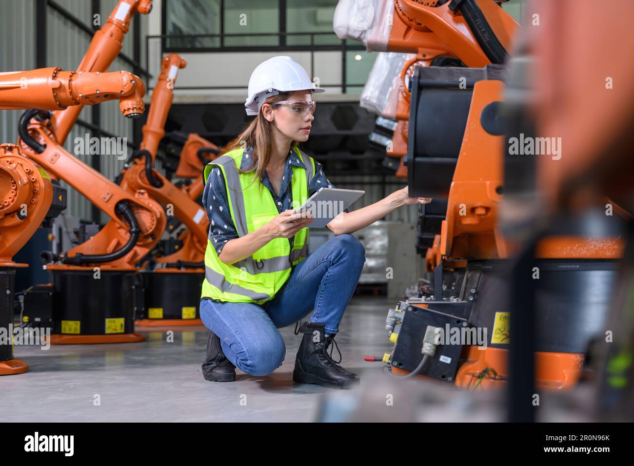 Factory worker managing industrial machine hi-res stock photography and ...