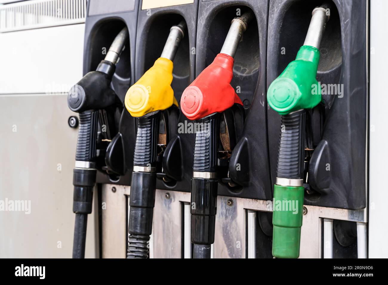 gas station. Pistols with gasoline and diesel fuel at a car gas station ...