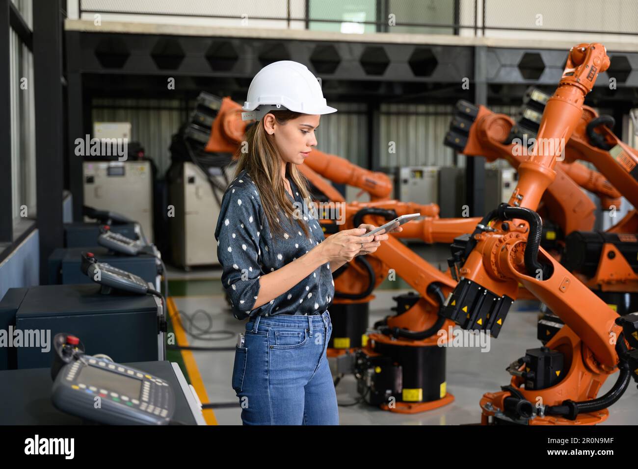 Factory worker managing industrial machine hi-res stock photography and ...
