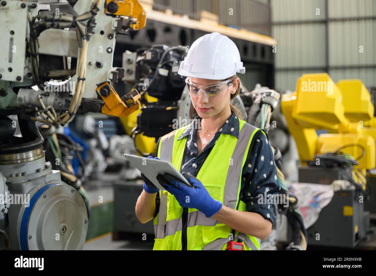 Factory worker managing industrial machine hi-res stock photography and ...