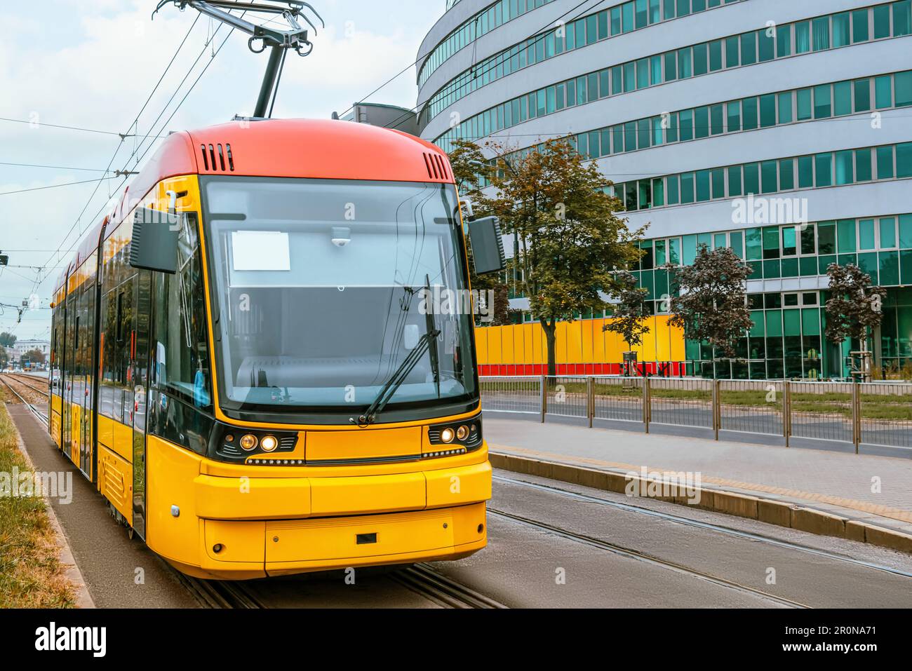 Modern tram on city street. Public transport Stock Photo - Alamy