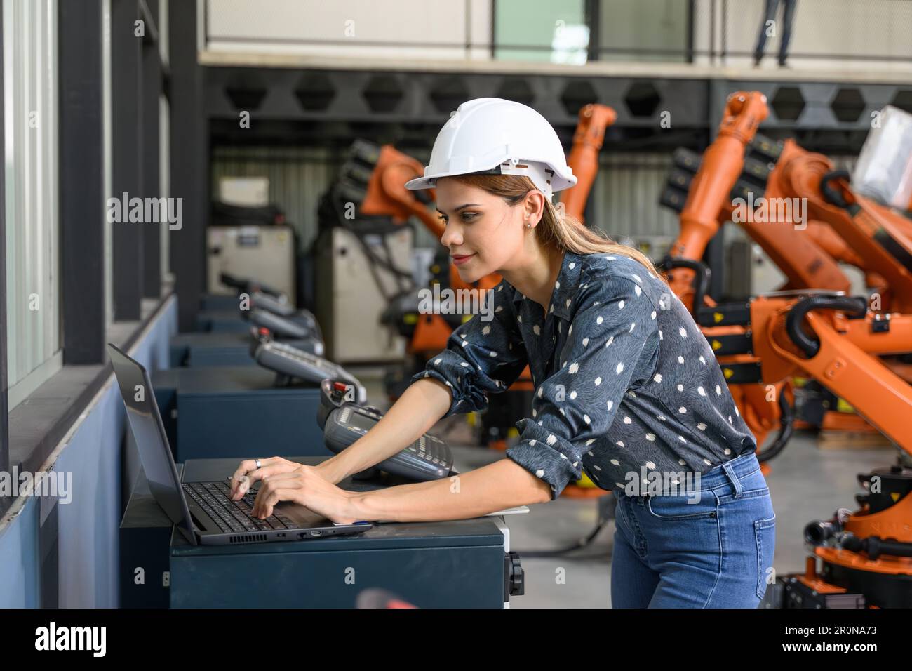 Factory worker managing industrial machine hi-res stock photography and ...