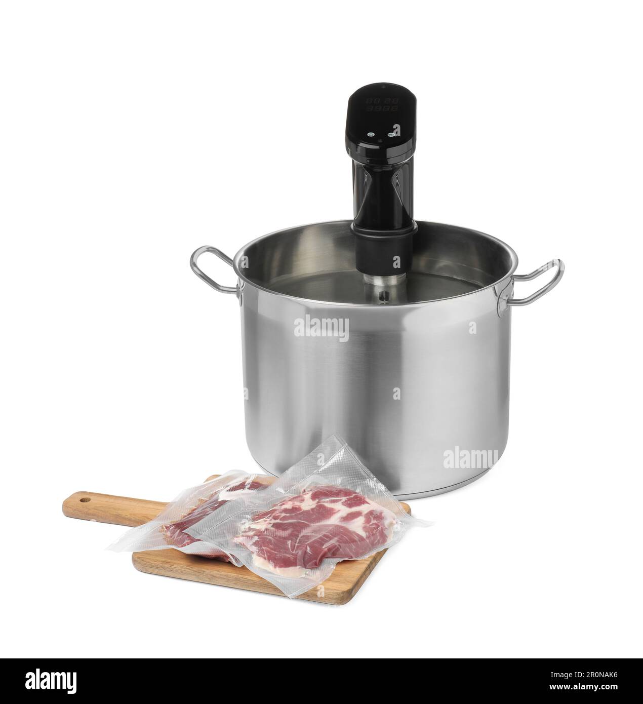 Thermal immersion circulator in pot and meat on white background ...