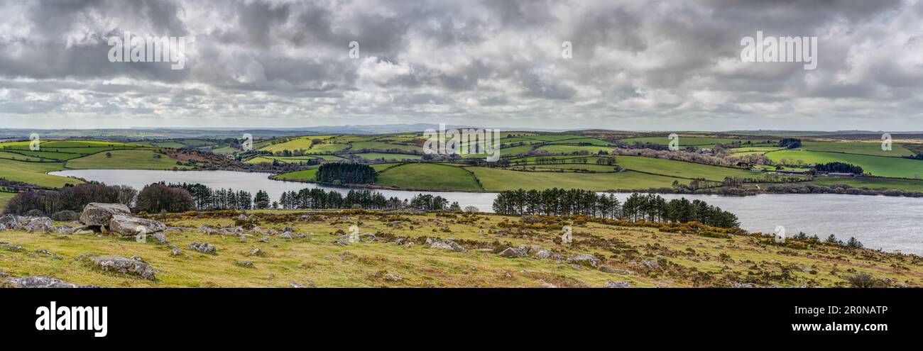 A wide colour panoramic landscape of a full reservoir in a natural ...