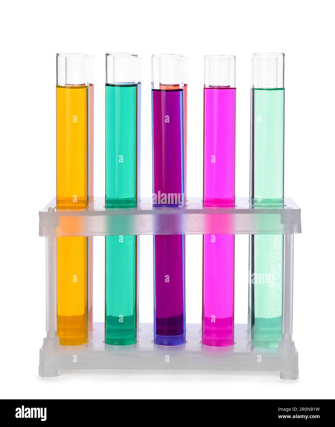Many test tubes with colorful liquids in stand on white background ...