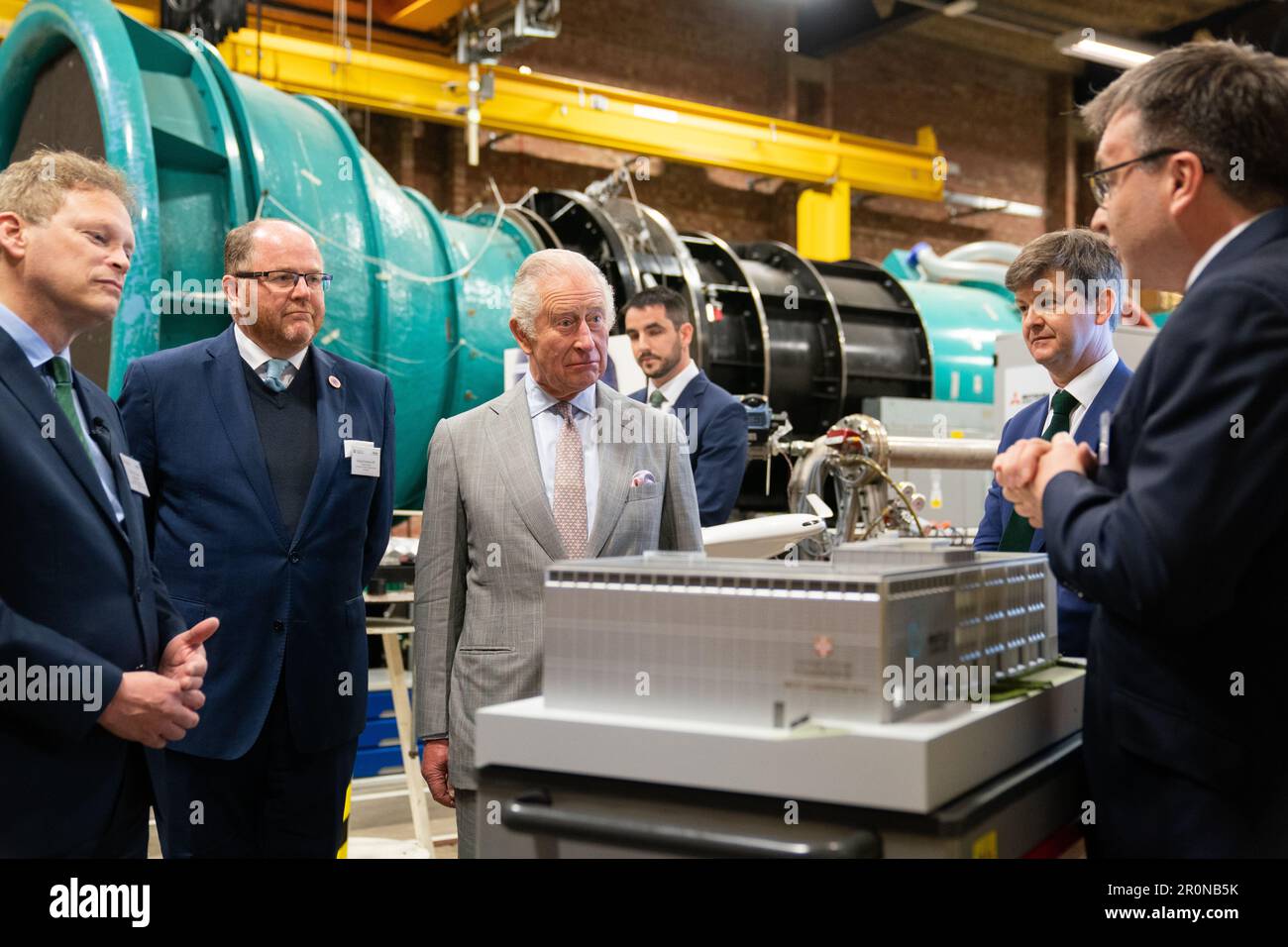 King Charles III views a model of the new laboratory during a visit to ...