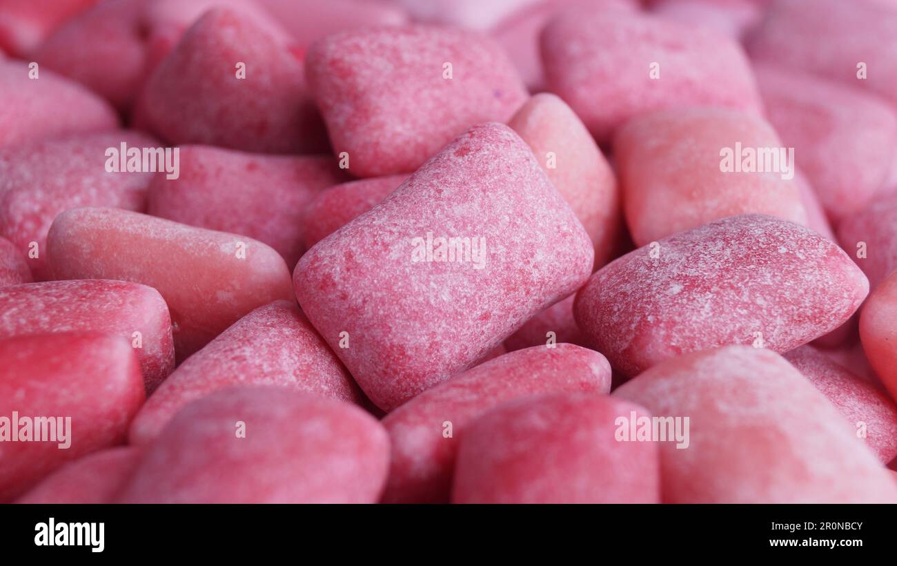 Many pink chewing gums as background, closeup Stock Photo - Alamy