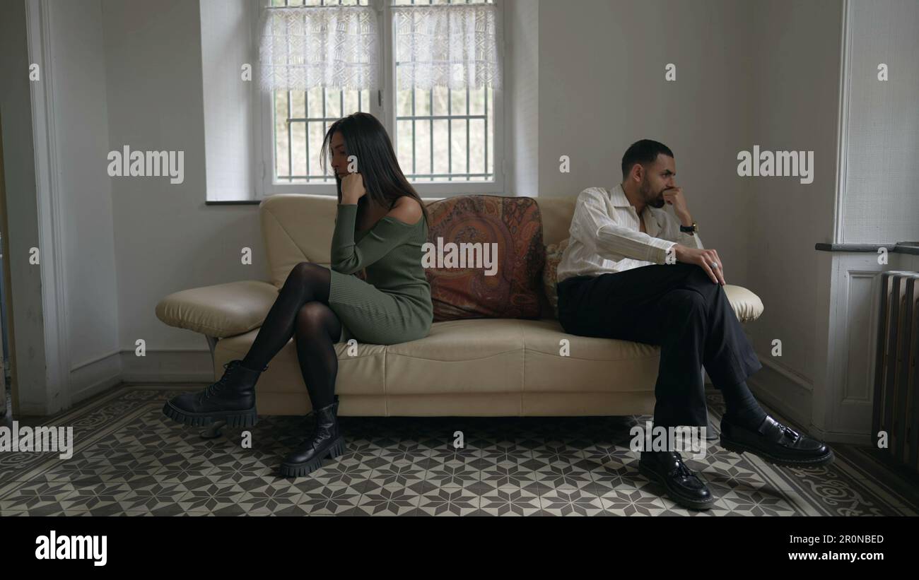 Alienated couple on the brink of separation. Young man and woman giving ...