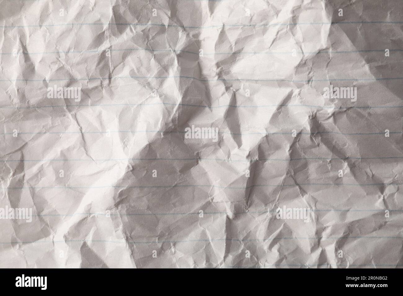 Crumpled sheet of paper as background, top view Stock Photo - Alamy