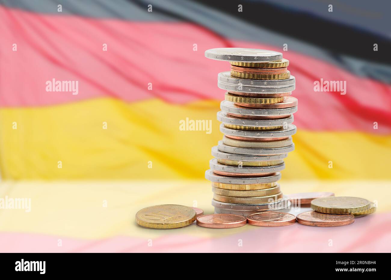 Coins stacked on each other in different positions with Germany flag ...