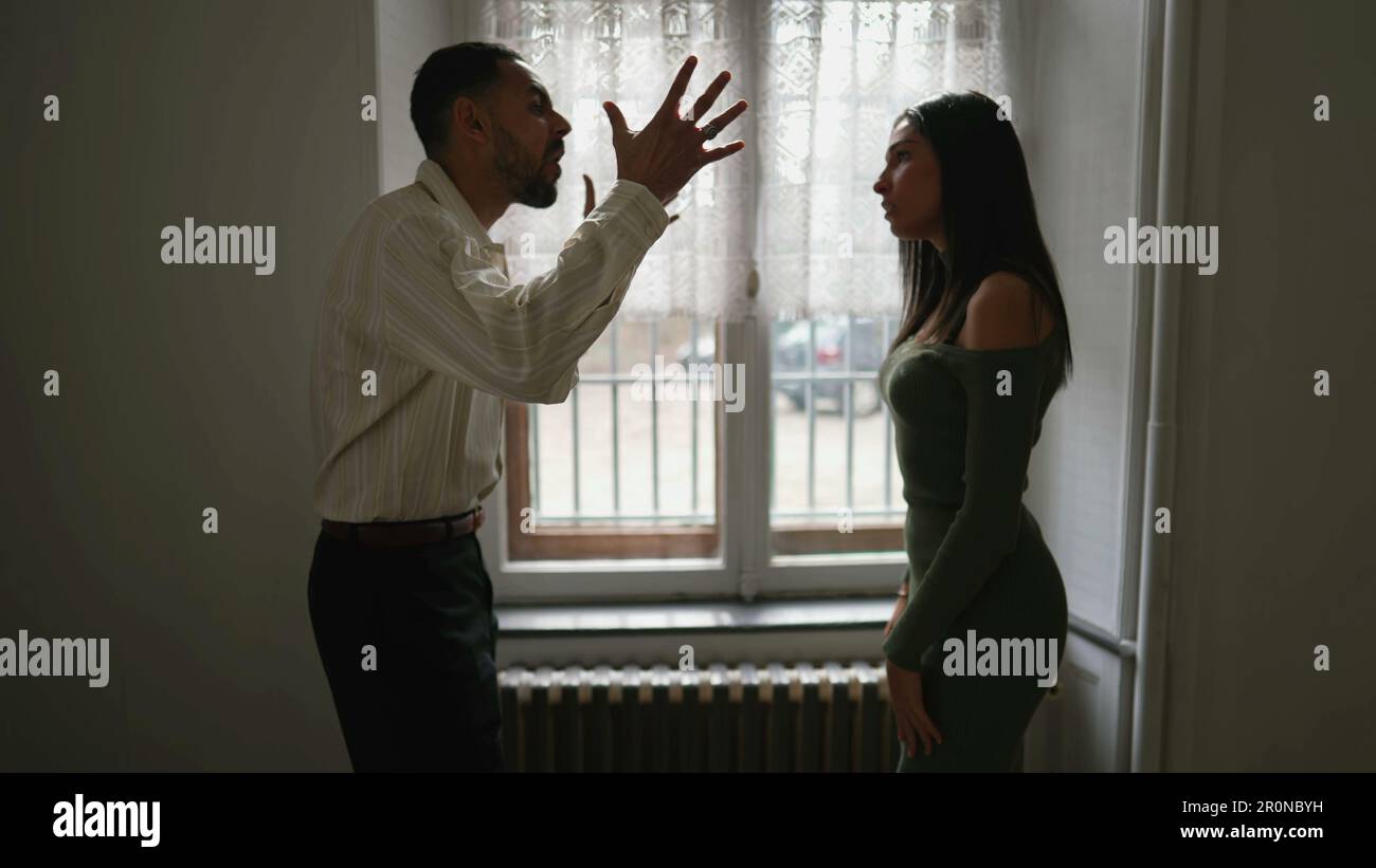 Dramatic couple shouting and yelling at each other. A young Middle ...