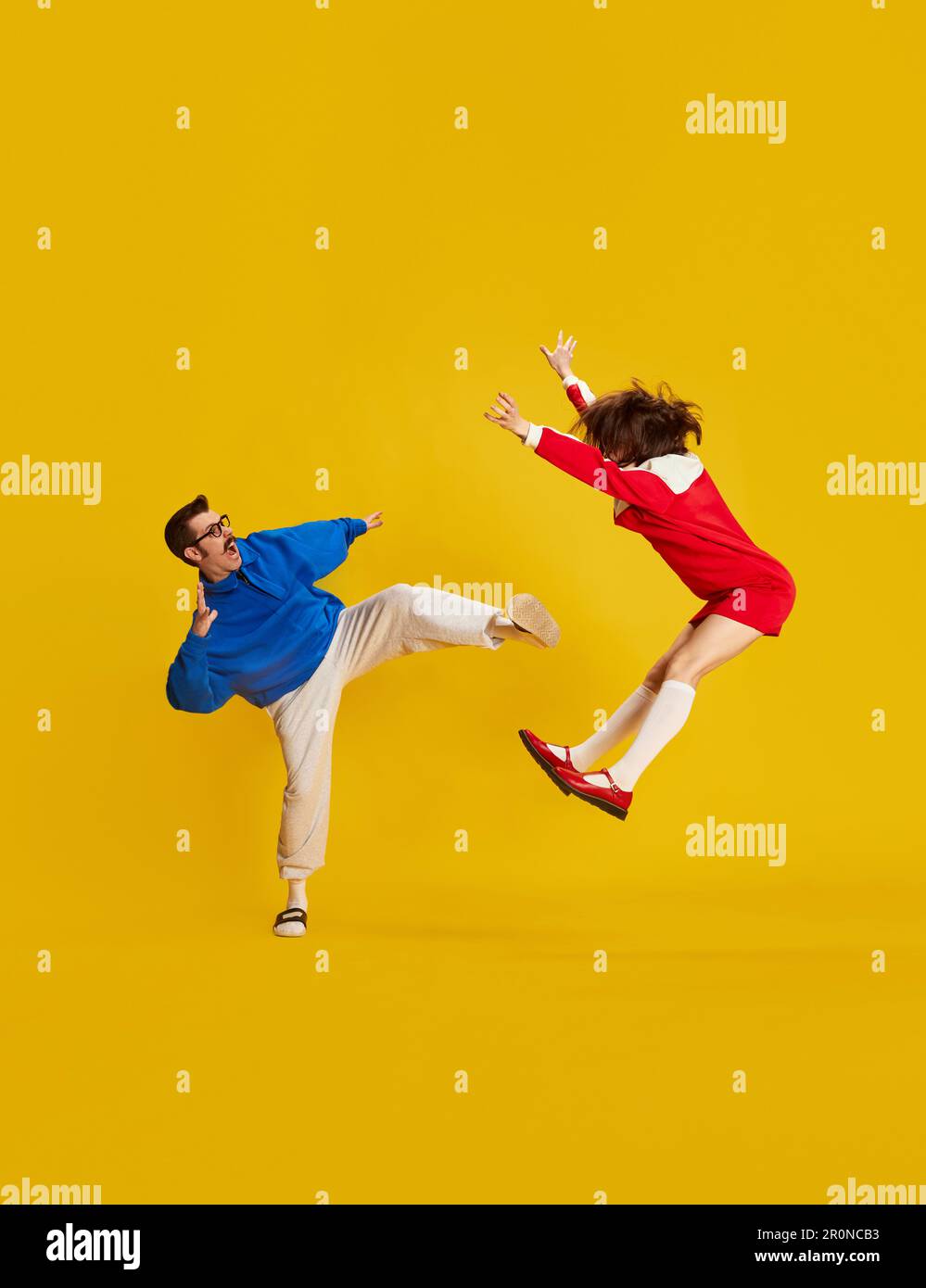 Portrait with funny couple, actors woman and man playing out a fight on ...