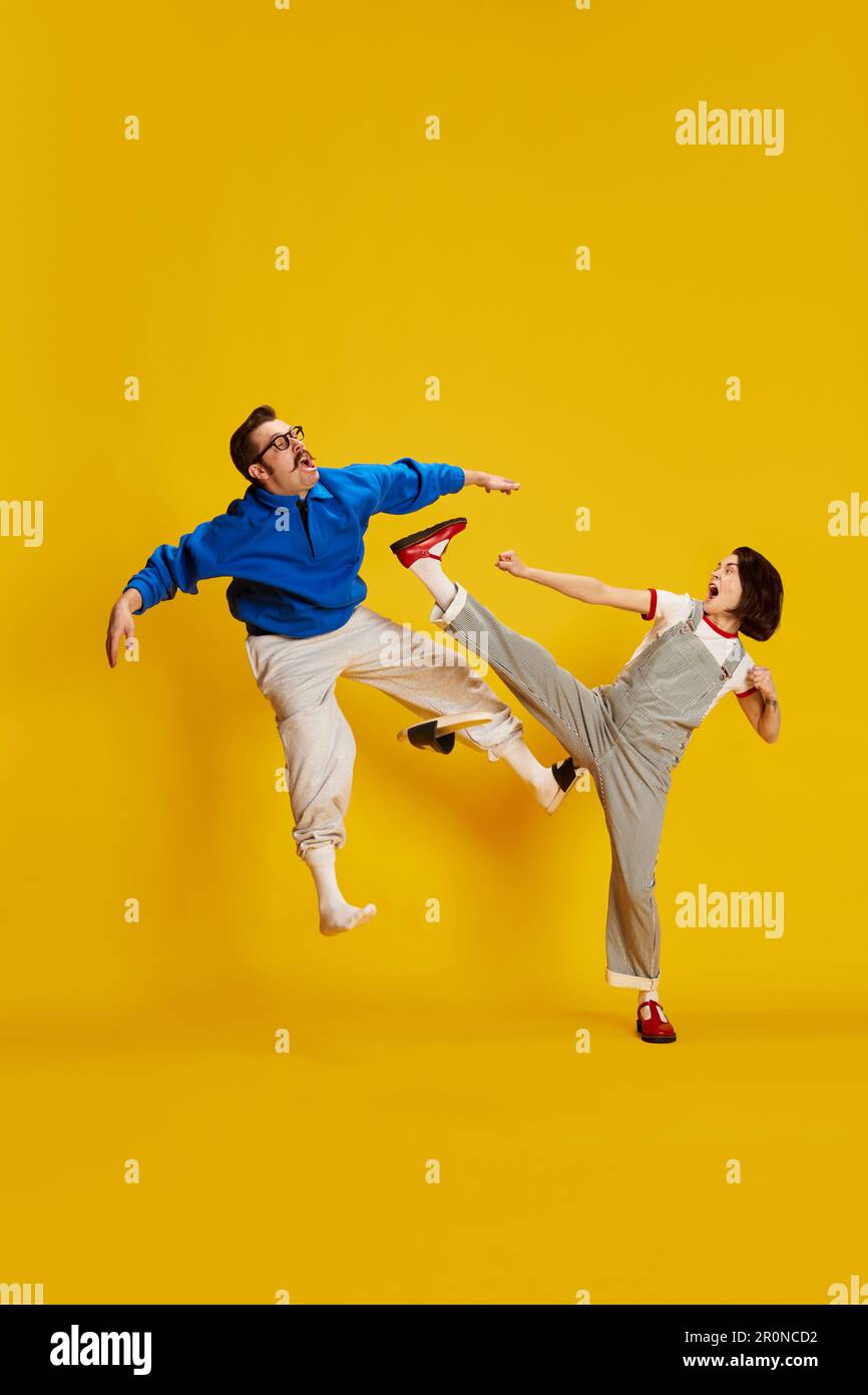 Portrait with funny couple, actors woman and man playing out a fight on ...