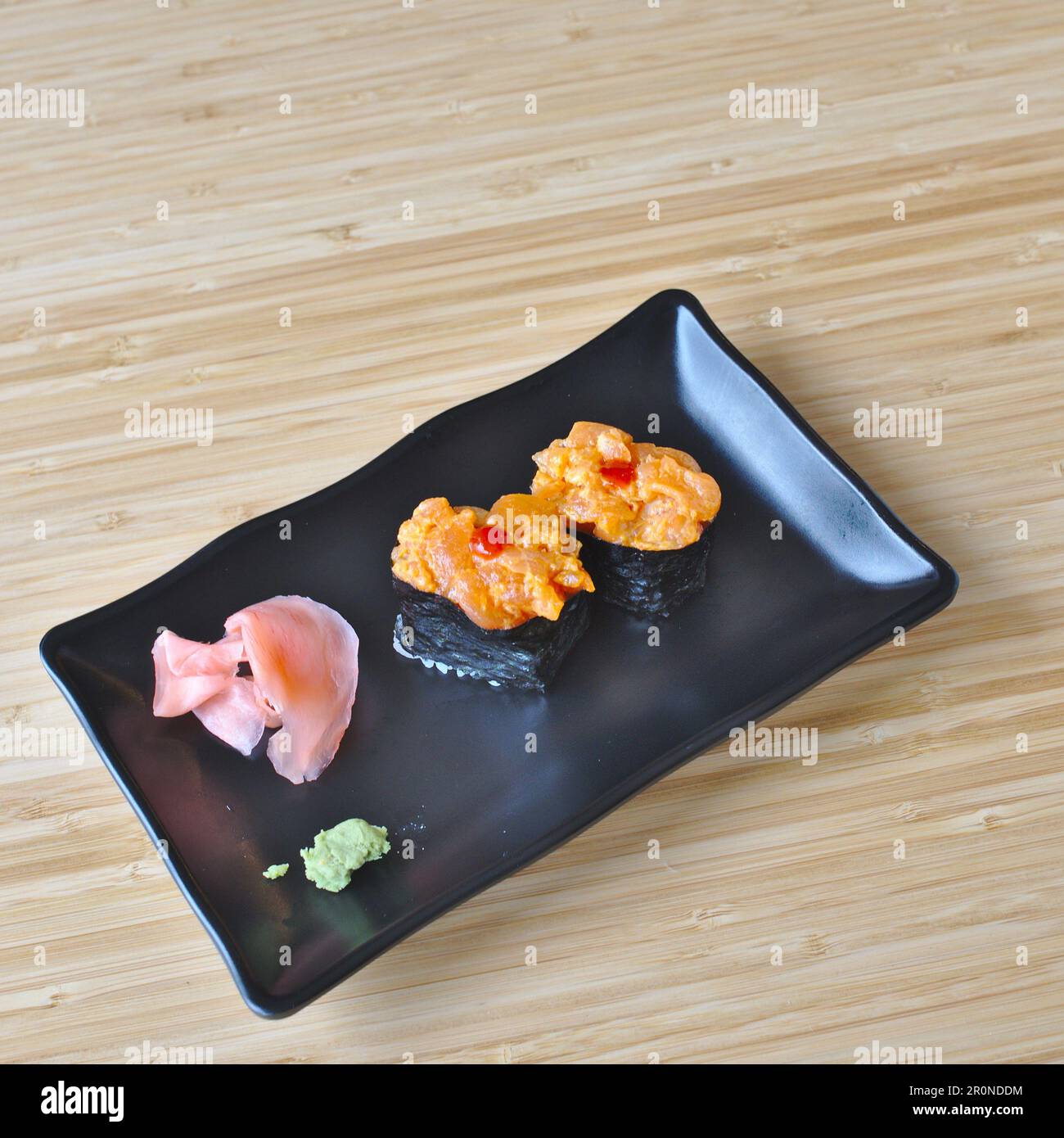 Asian Japanese Food Sushi Spicy Salmon Gunkan Stock Photo - Alamy