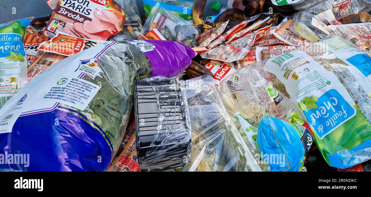Expired foods in a garbage dumpster, Lyon, France Stock Photo - Alamy