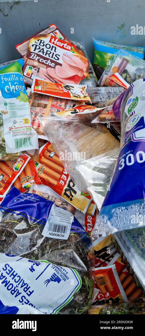Expired foods in a garbage dumpster, Lyon, France Stock Photo - Alamy