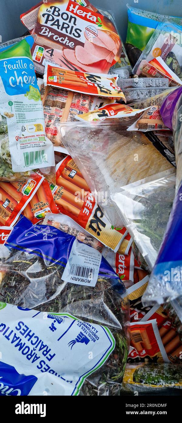 Expired foods in a garbage dumpster, Lyon, France Stock Photo - Alamy