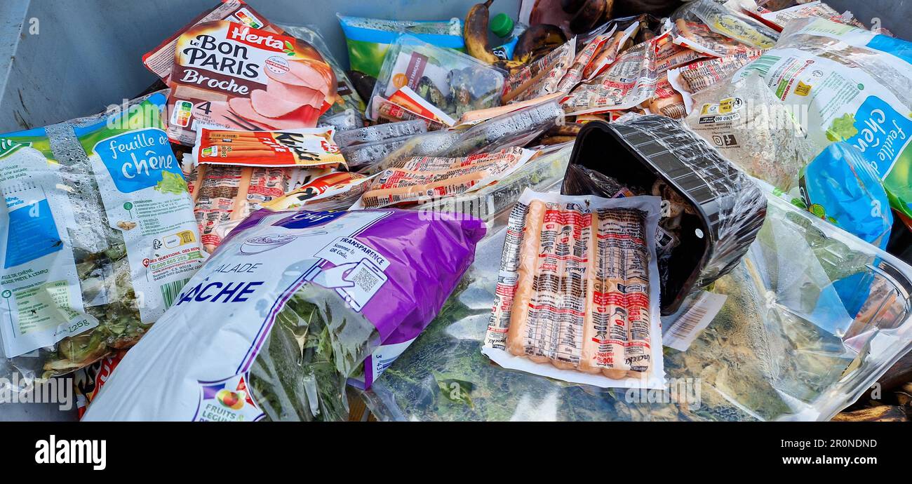 Expired foods in a garbage dumpster, Lyon, France Stock Photo - Alamy