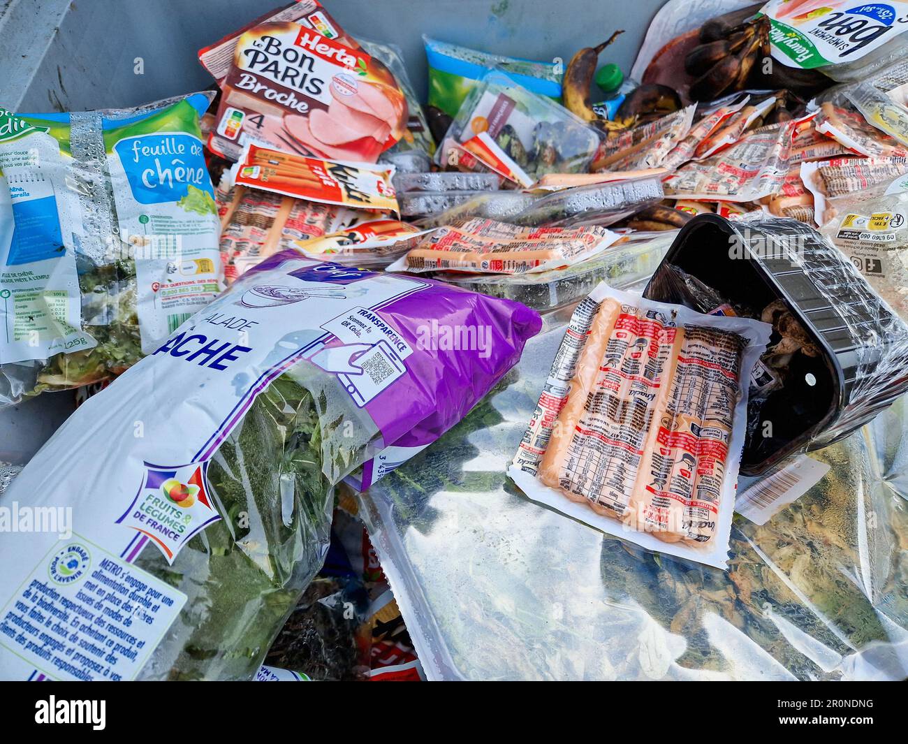 Expired foods in a garbage dumpster, Lyon, France Stock Photo - Alamy