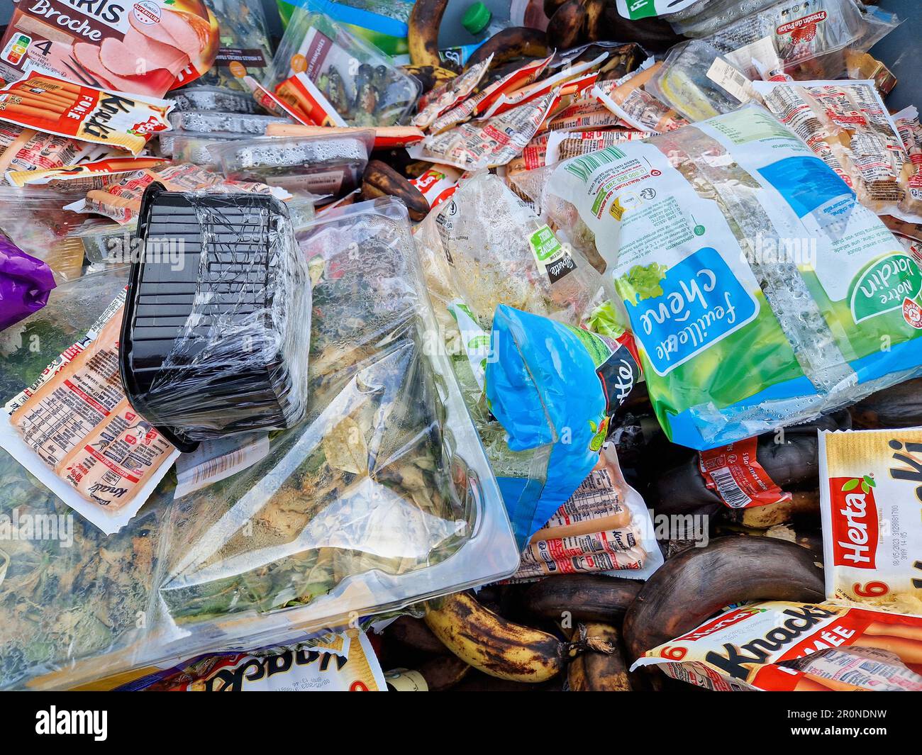 Expired foods in a garbage dumpster, Lyon, France Stock Photo - Alamy