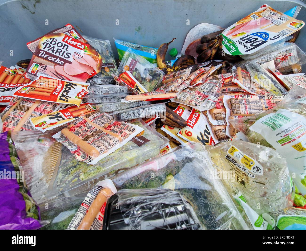 Expired foods in a garbage dumpster, Lyon, France Stock Photo - Alamy