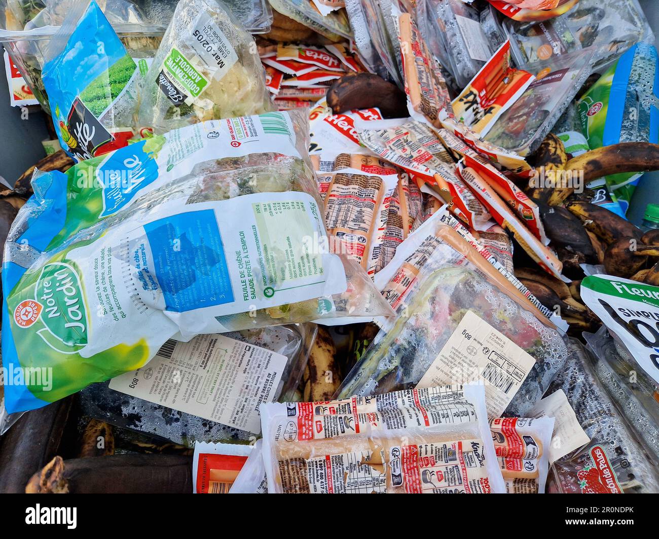 Expired foods in a garbage dumpster, Lyon, France Stock Photo - Alamy