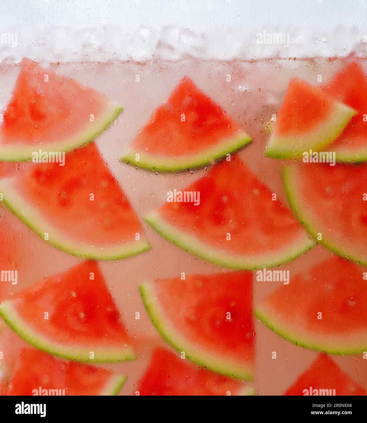 Cold water flavored with watermelon slices Stock Photo - Alamy