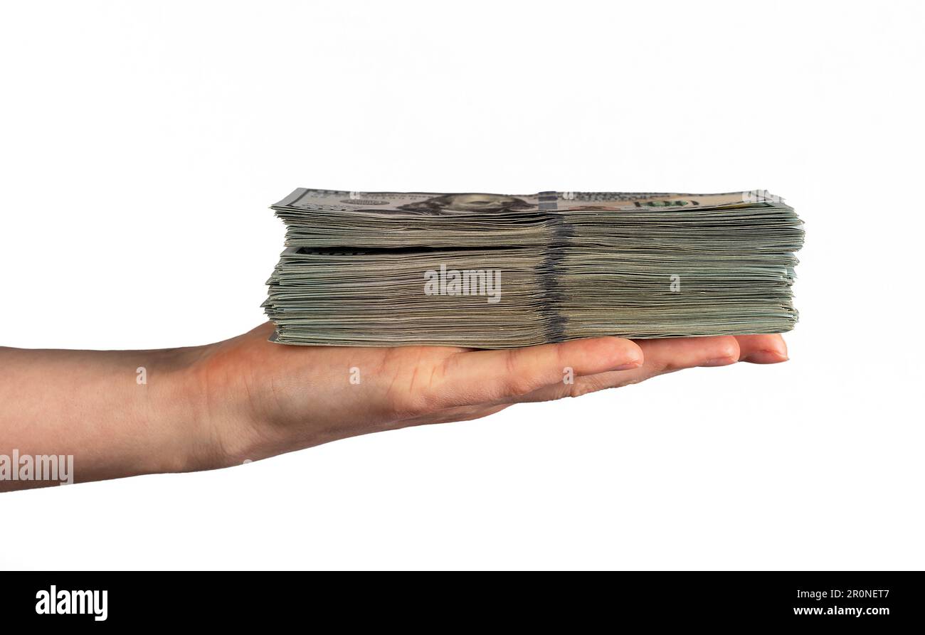 Dollar stack on hand palm isolated on white Stock Photo - Alamy