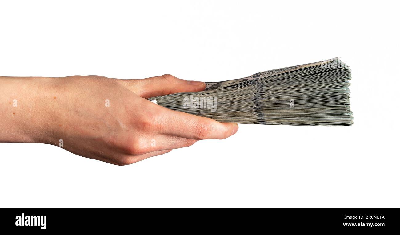 Hand giving dollar, many cash, paper bills, side view Stock Photo - Alamy