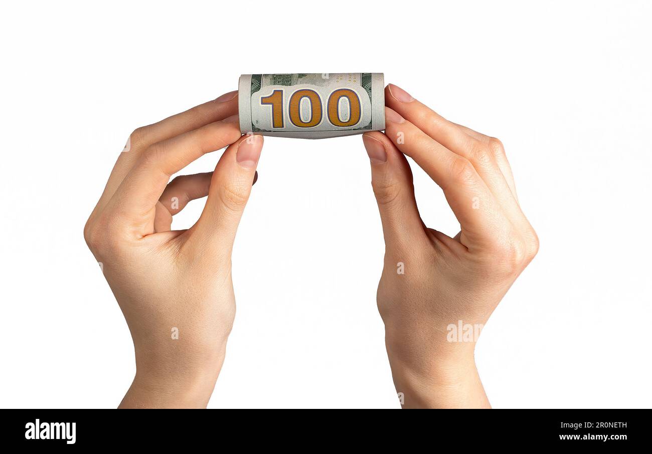 100 dollar bill, rolled paper banknote in hands isolated on white ...