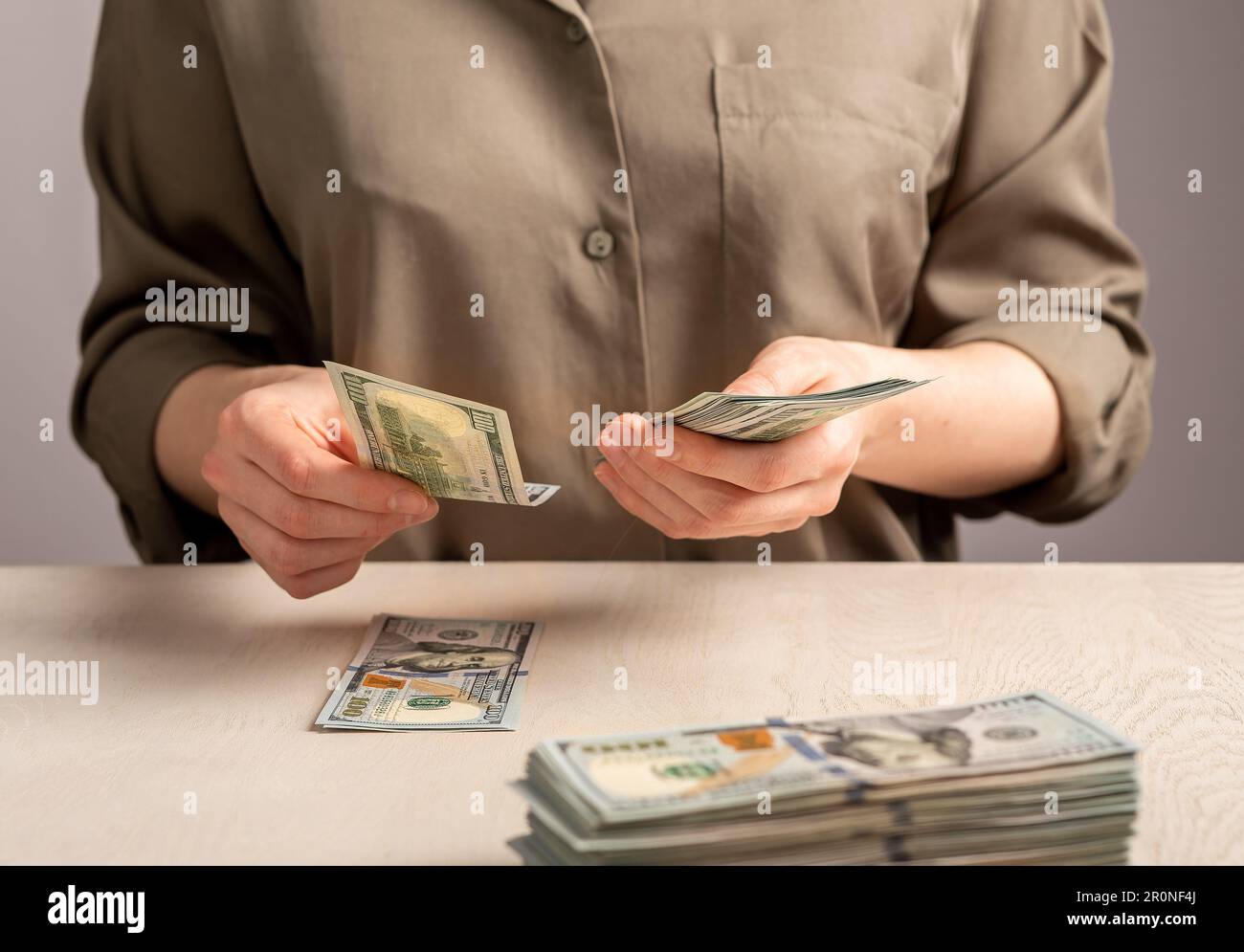 Counting money, dollar bills, cash savings Stock Photo - Alamy