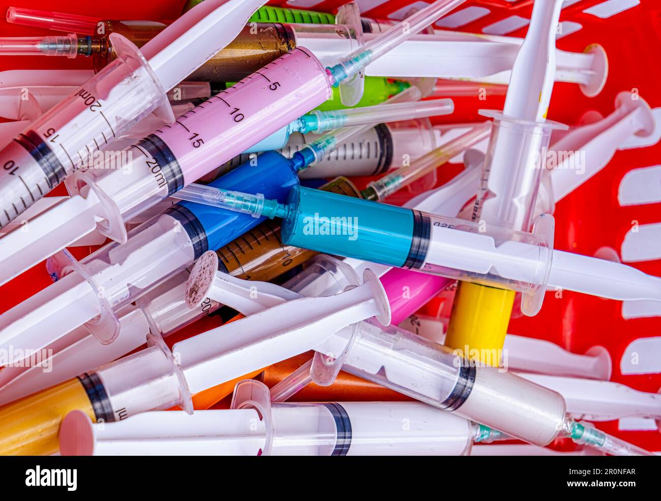 a bunch of Syringes with multi-colored liquid Stock Photo - Alamy