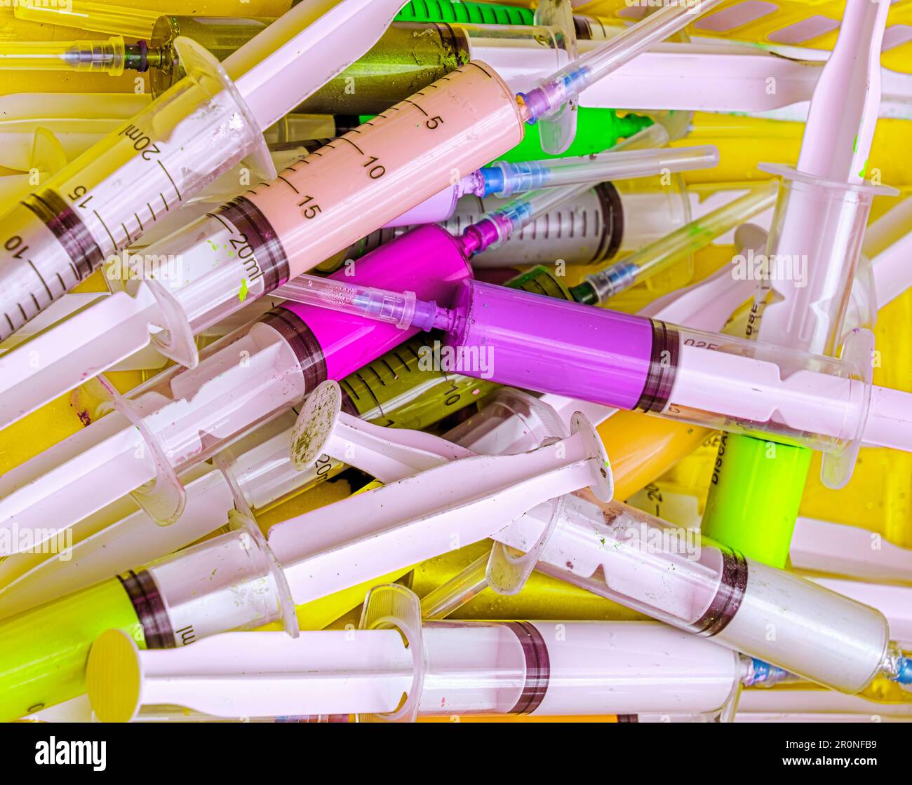 a bunch of Syringes with multi-colored liquid Stock Photo - Alamy