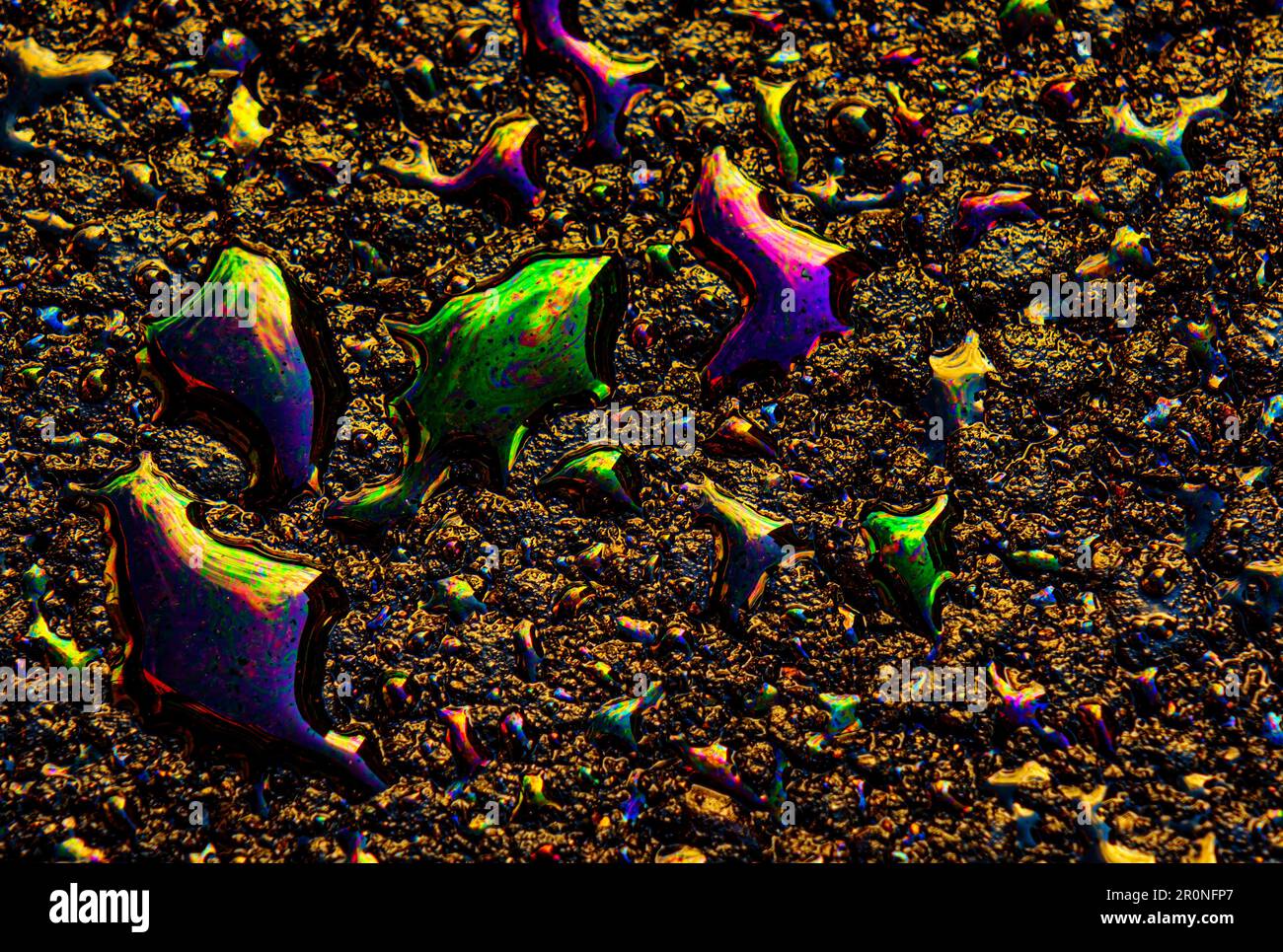 Oil stain on Asphalt road after rain, color Gasoline fuel spots on ...