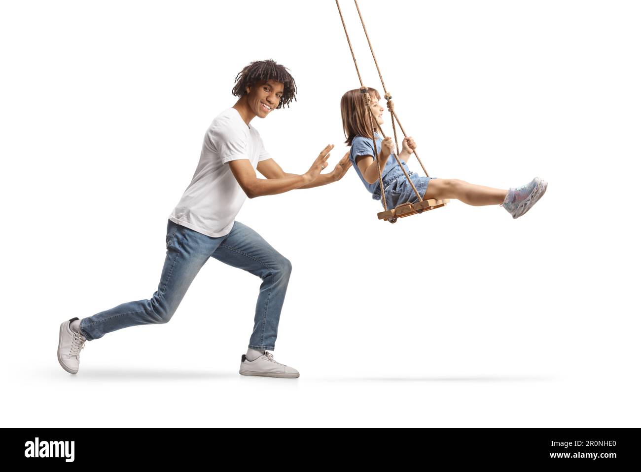 Girl pushing swing hi-res stock photography and images - Alamy