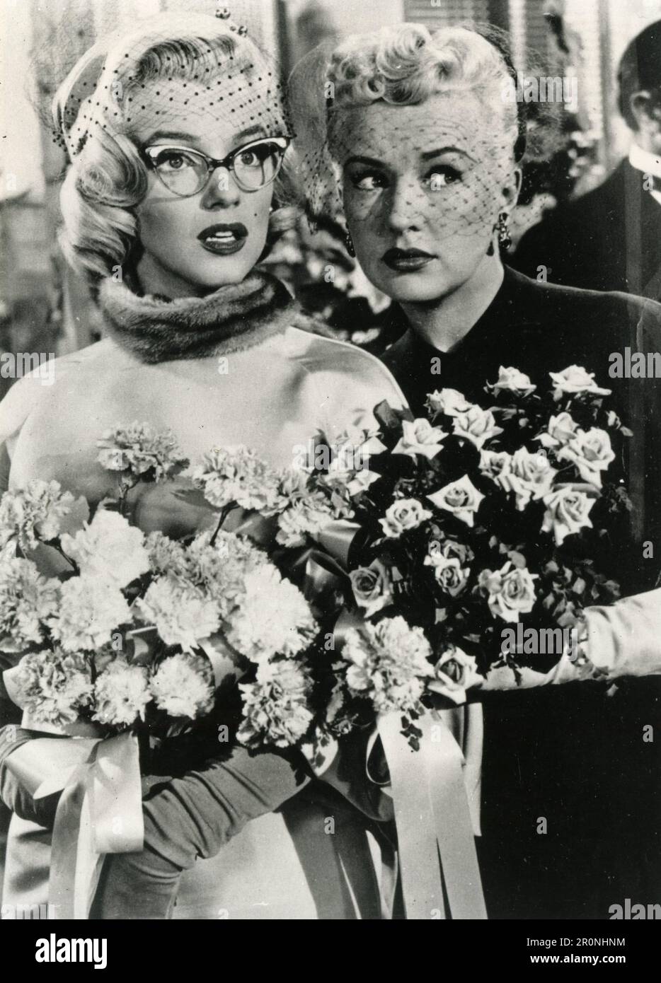 Actresses Marilyn Monroe and Betty Gable in the movie How To Marry a ...