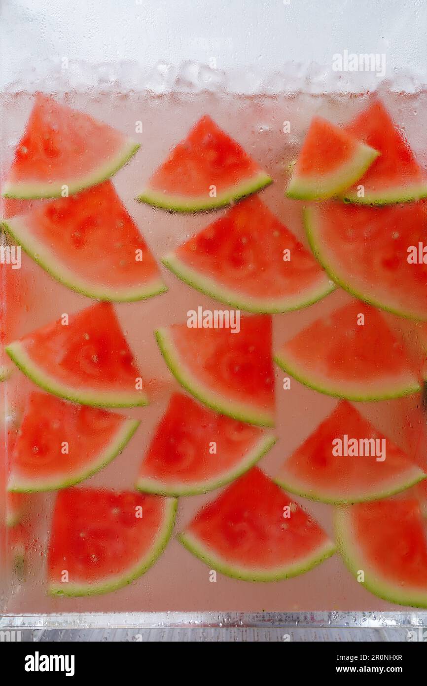 Cold water flavored with watermelon slices Stock Photo - Alamy