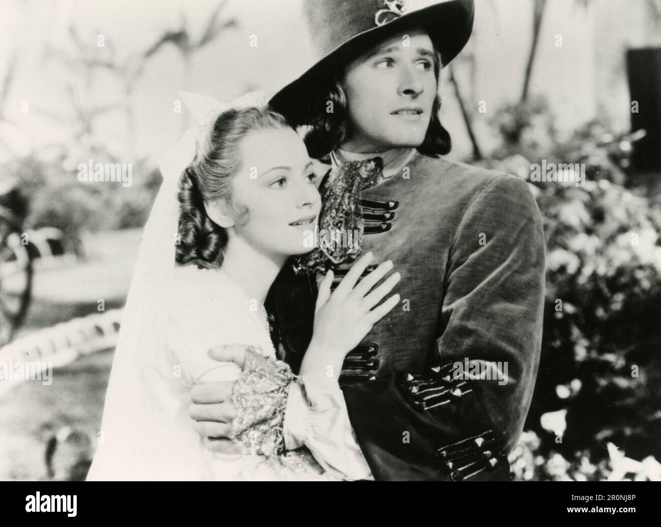 Actress Olivia de Havilland and actor Errol Flynn in the movie Captain Blood, USA 1935 Stock ...