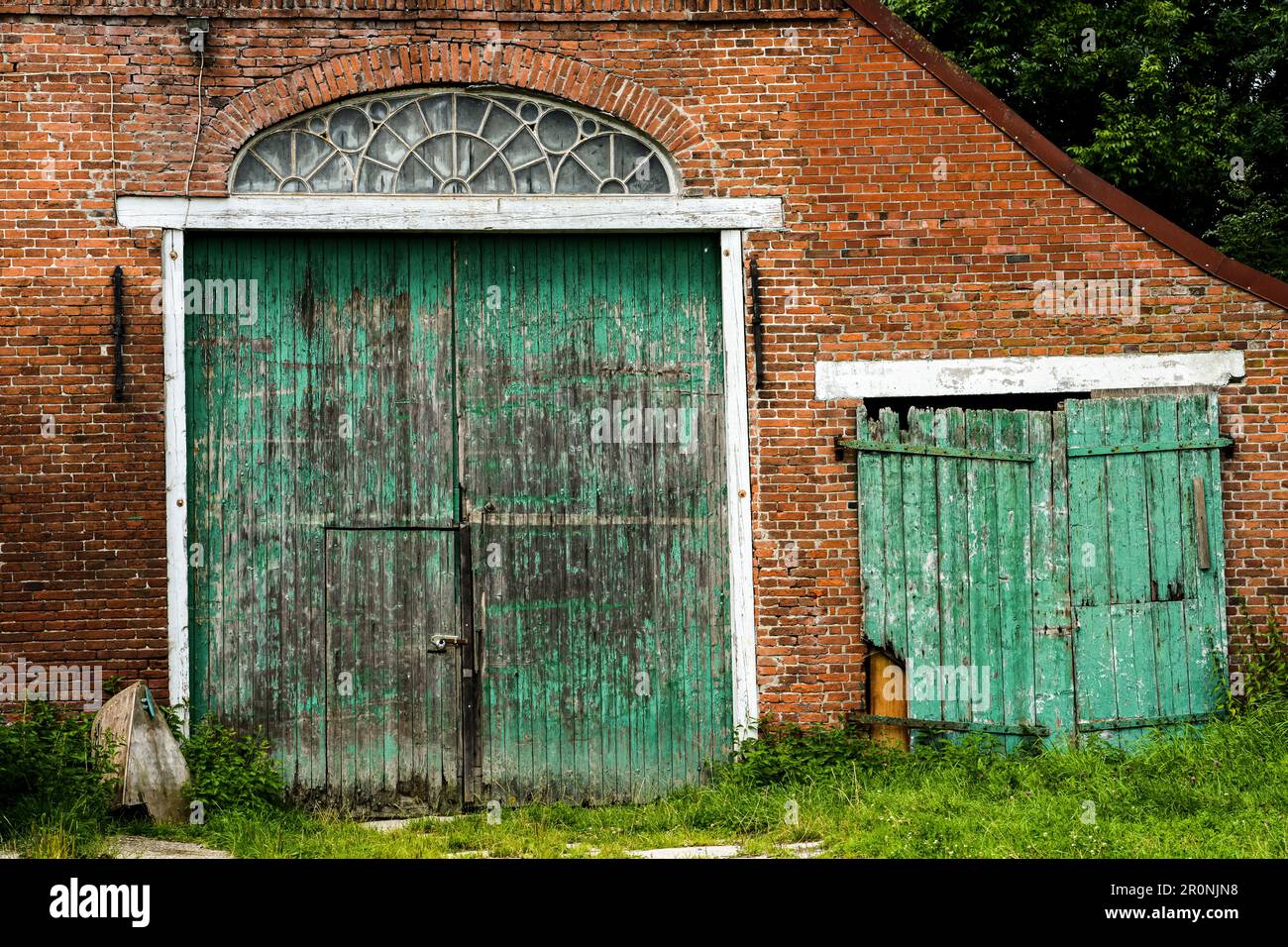 Old wooden gates on a brick building in Krummhörn. Germany ...