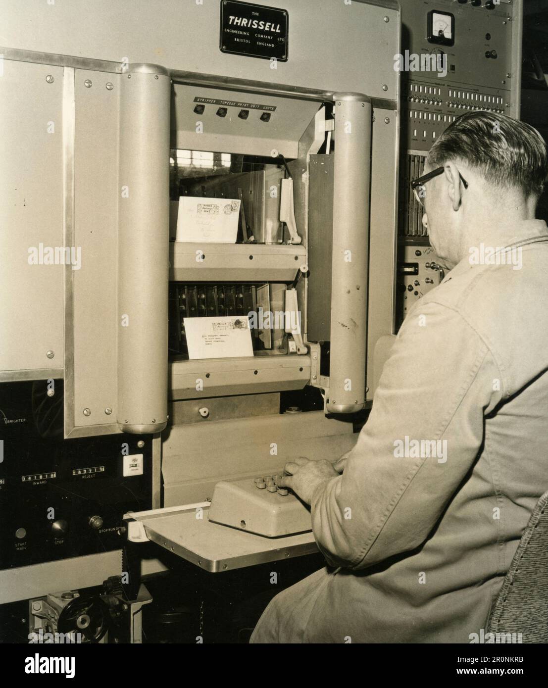 British postman operating a coding machine to mechanize Britain's mails ...