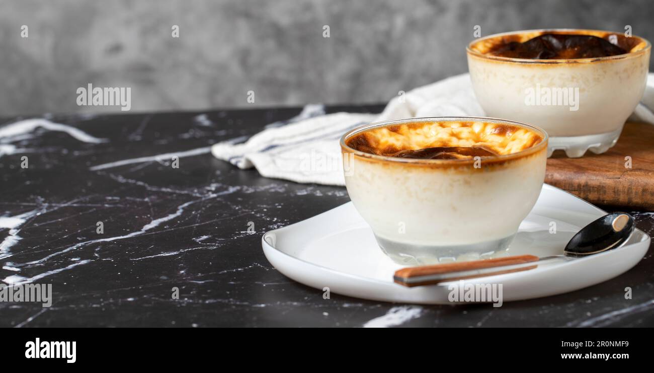 Rice pudding on a dark background. Rice pudding dessert made with milk ...