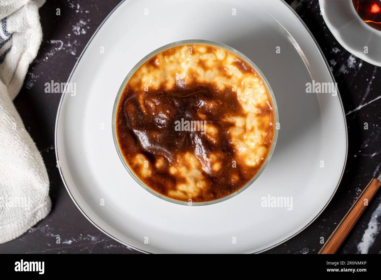 Rice pudding on a dark background. Rice pudding dessert made with milk ...