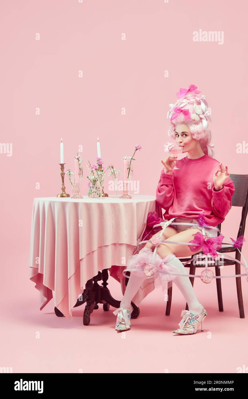 Portrait of young princess, queen wearing elegant pink clothes, and wig ...